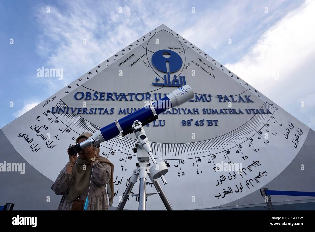 Medan, Indonesia. 22nd Mar, 2023. An officer observes the position of ...