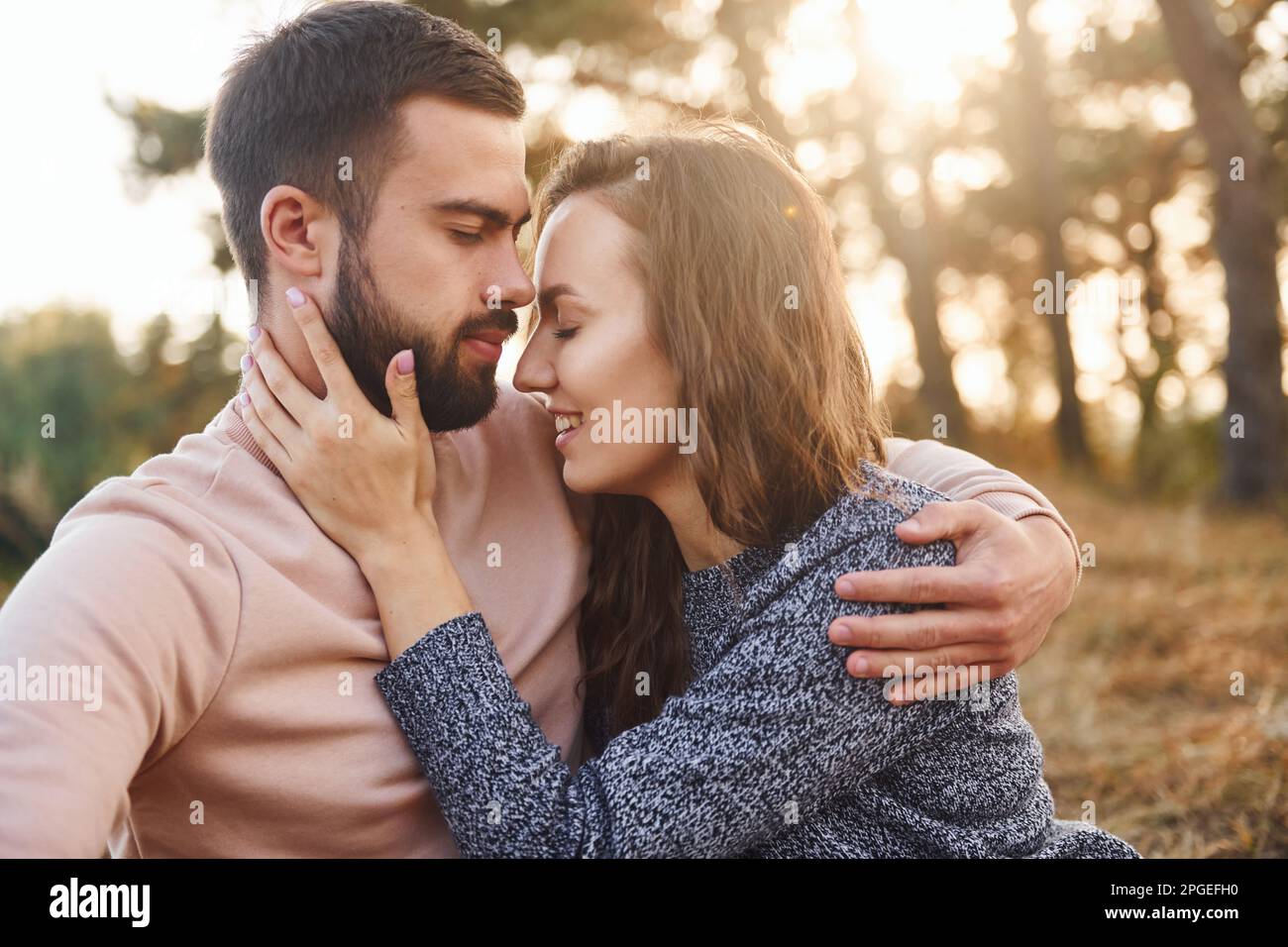 Closeness of the people. Cheerful lovely young couple having a rest ...