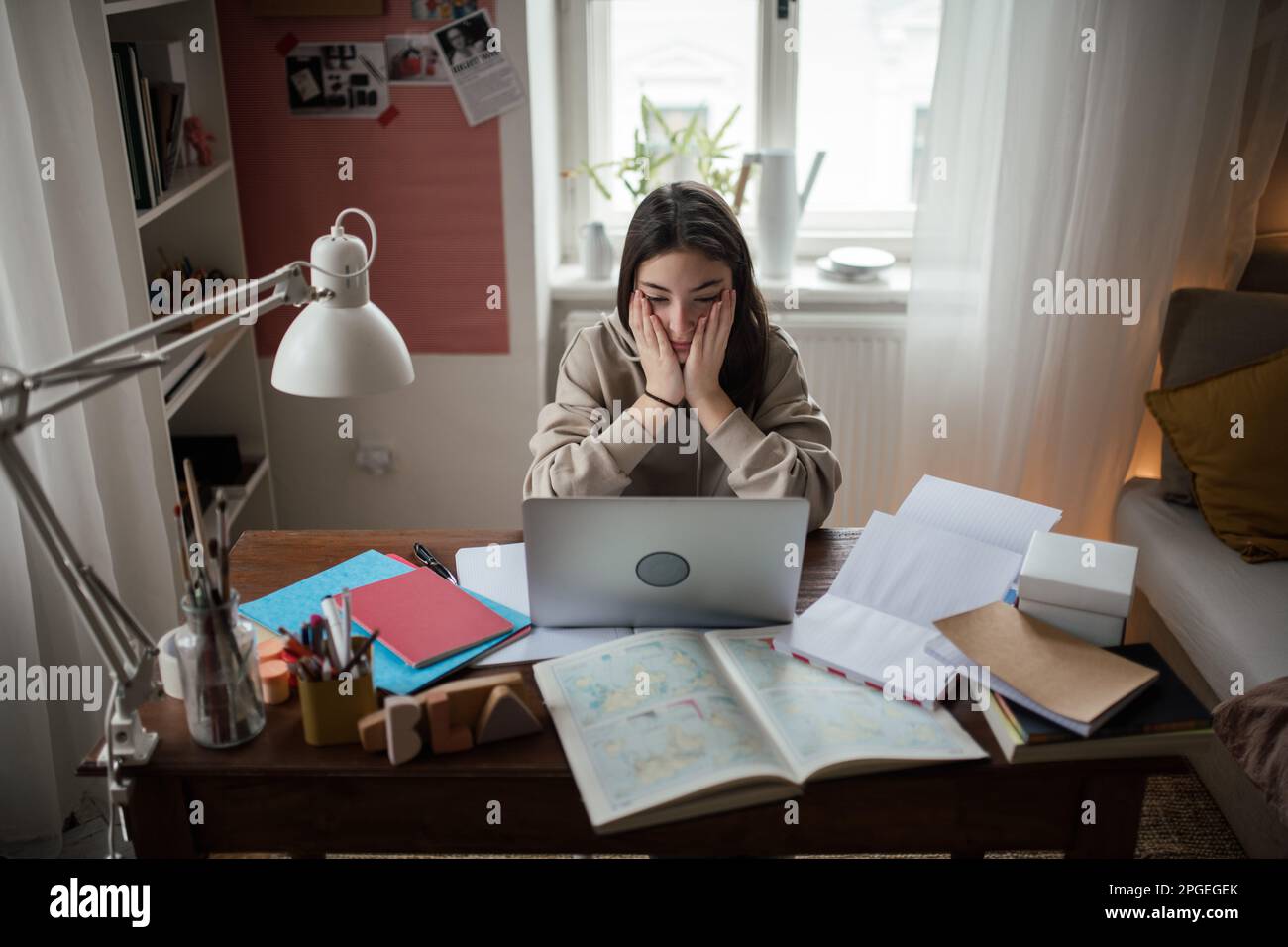 Young teenage girl studying in her room Stock Photo - Alamy