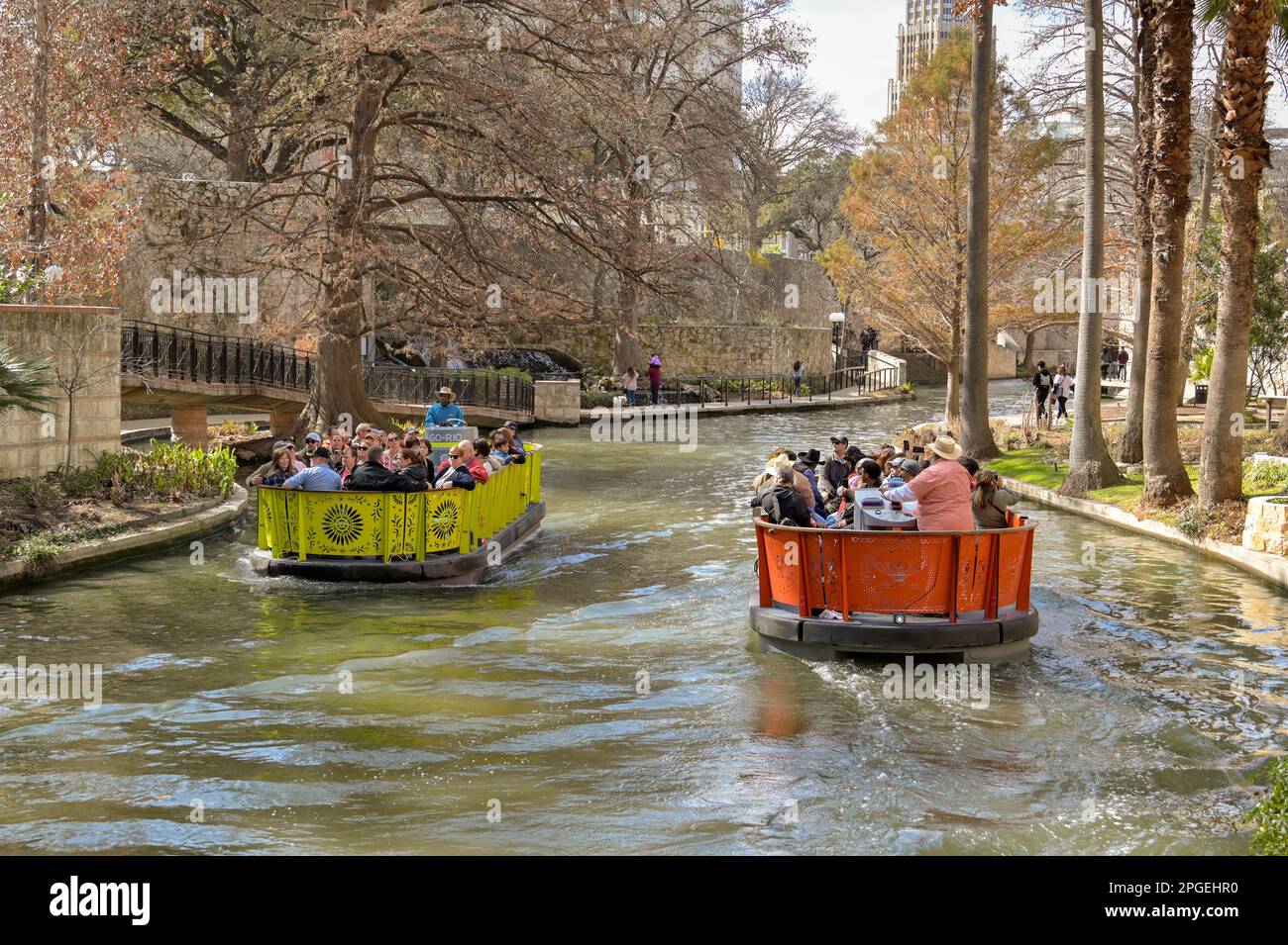 San Antonio, Texas, USA - February 2023: Visitors on river boats which ...