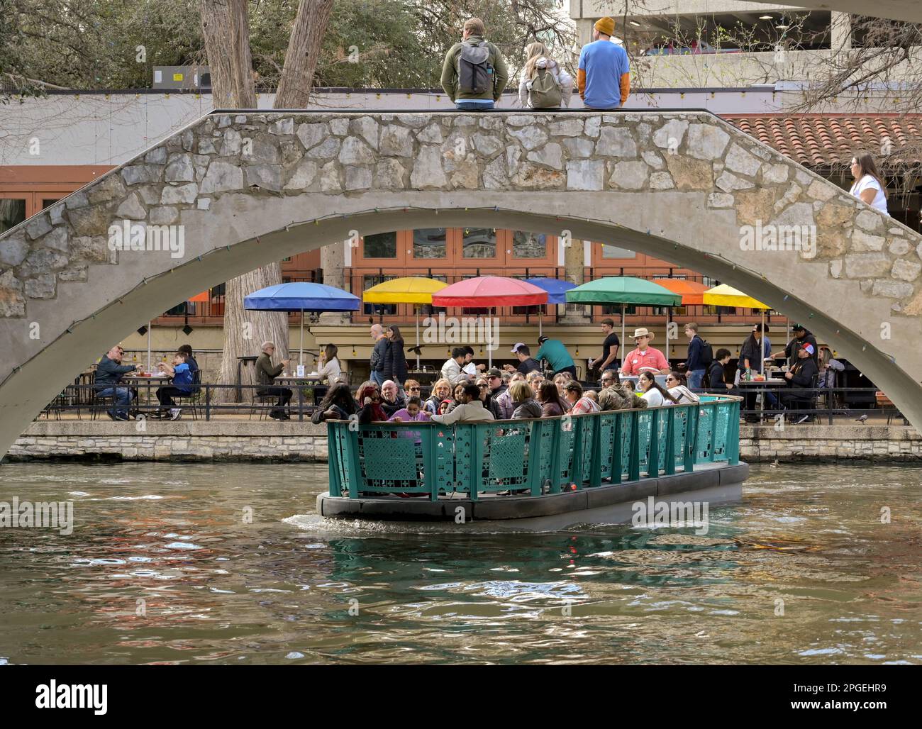 San Antonio, Texas, USA - February 2023: Visitors on a river boat which ...