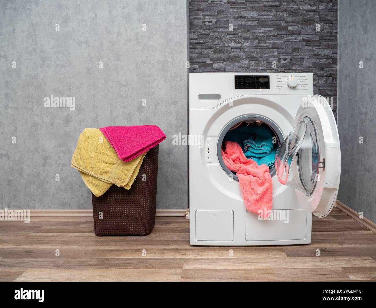 Laundry room interior with washing machine against the wall. Modern ...