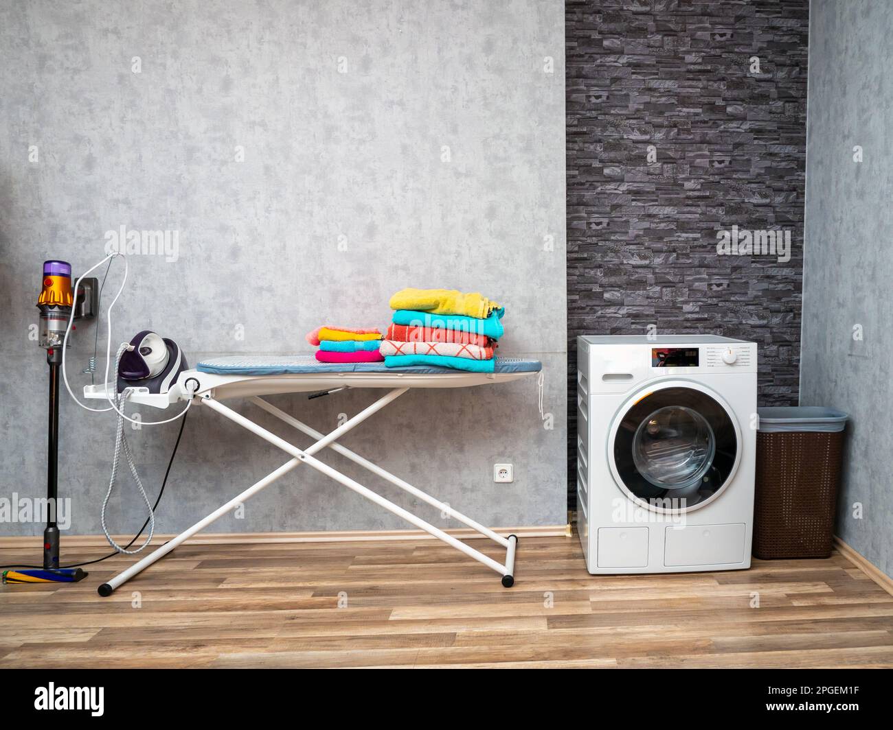 Laundry room interior with washing machine against the wall. Modern ...