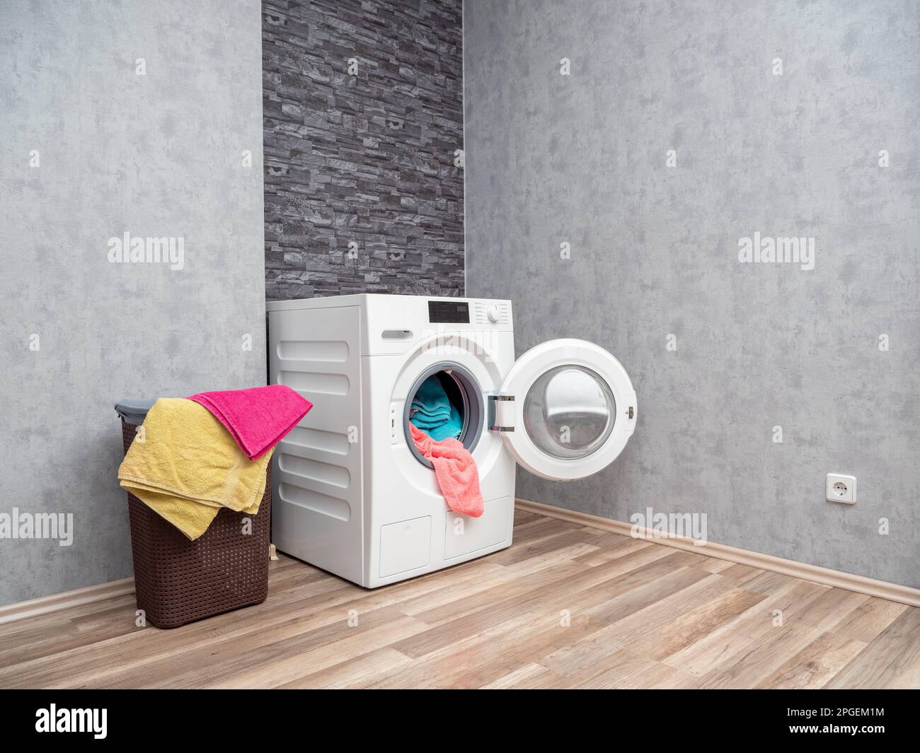 Laundry room interior with washing machine against the wall. Modern ...