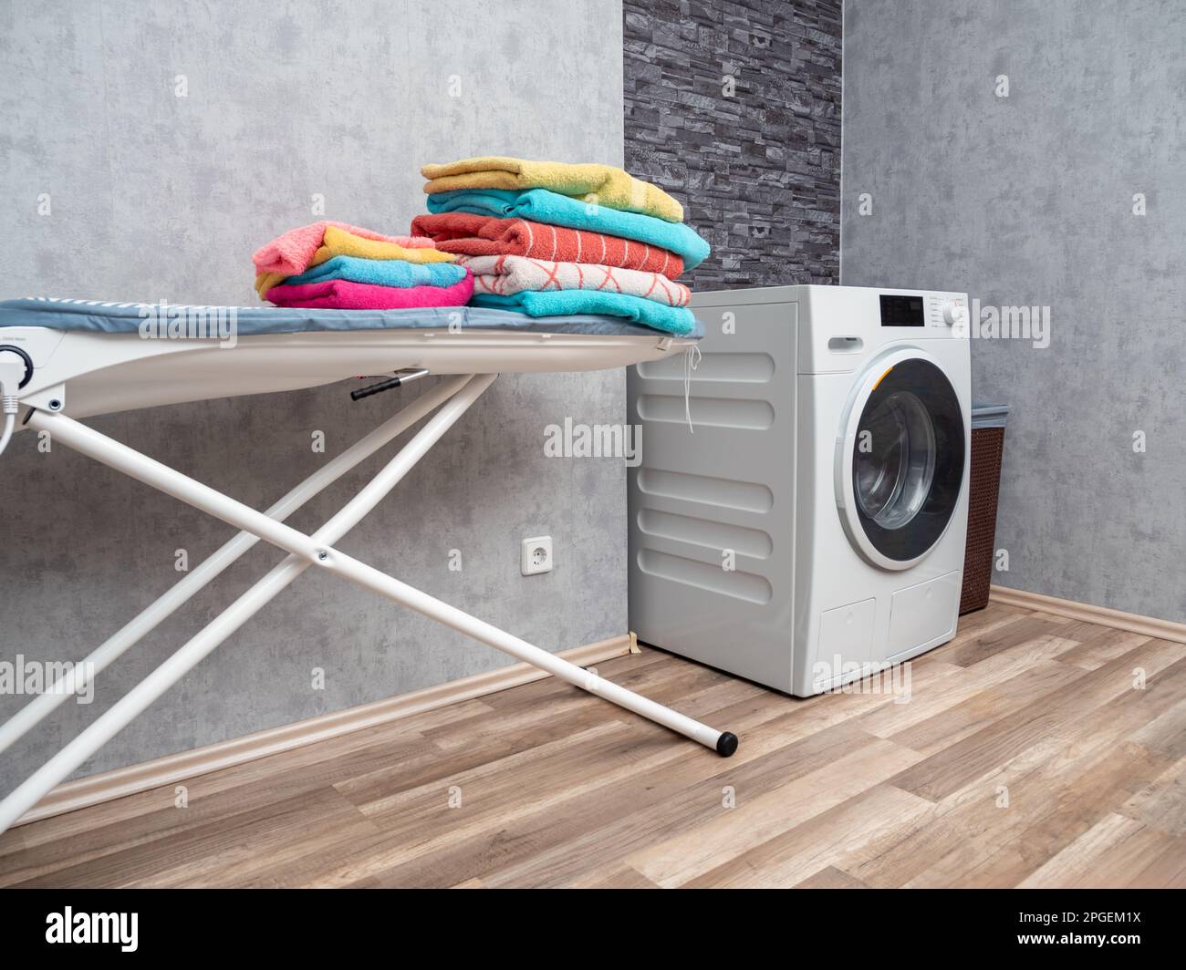 Laundry room interior with washing machine against the wall. Modern ...