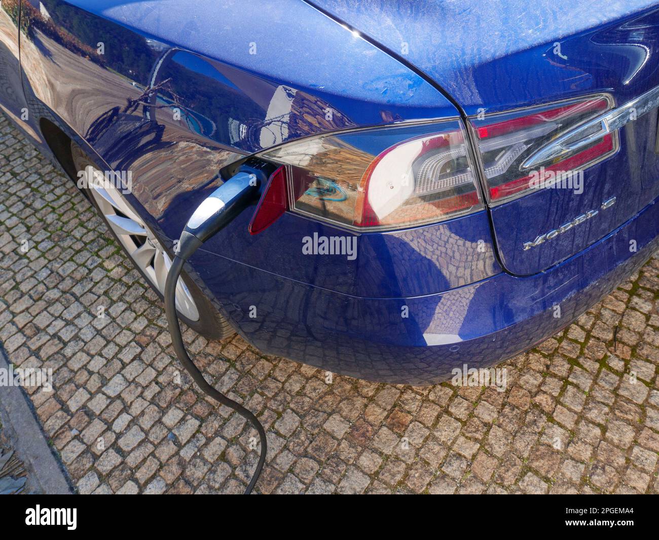 Blue Tesla model S charging Stock Photo - Alamy