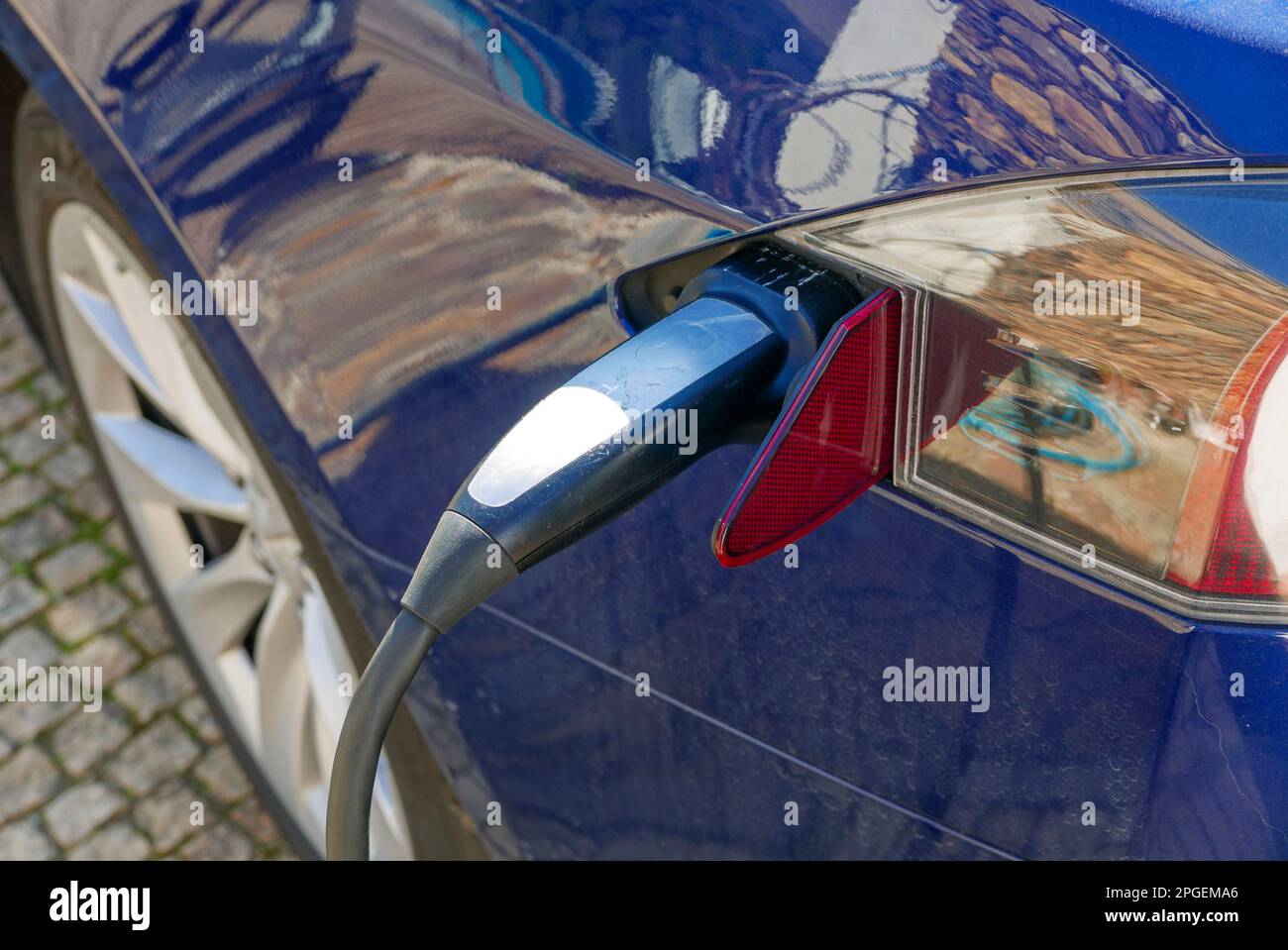 Blue Tesla model S charging Stock Photo - Alamy