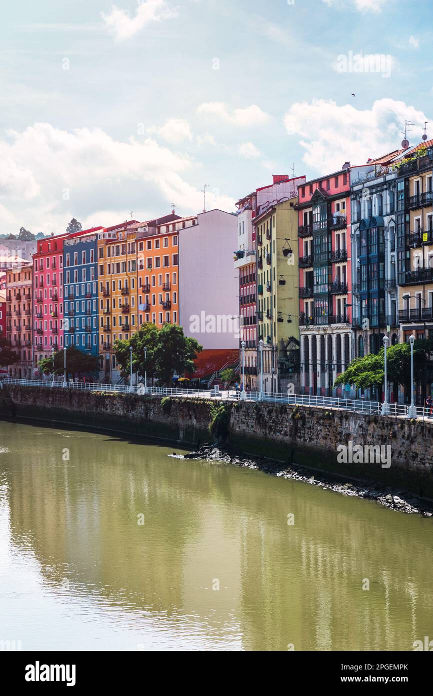 Colorful architecture and the Nervion river in Bilbao city. Enjoying a ...