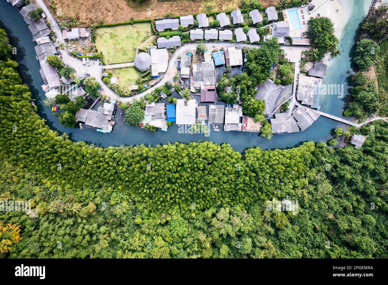 Top view of abundance mangrove forest and the resort by the river in ...