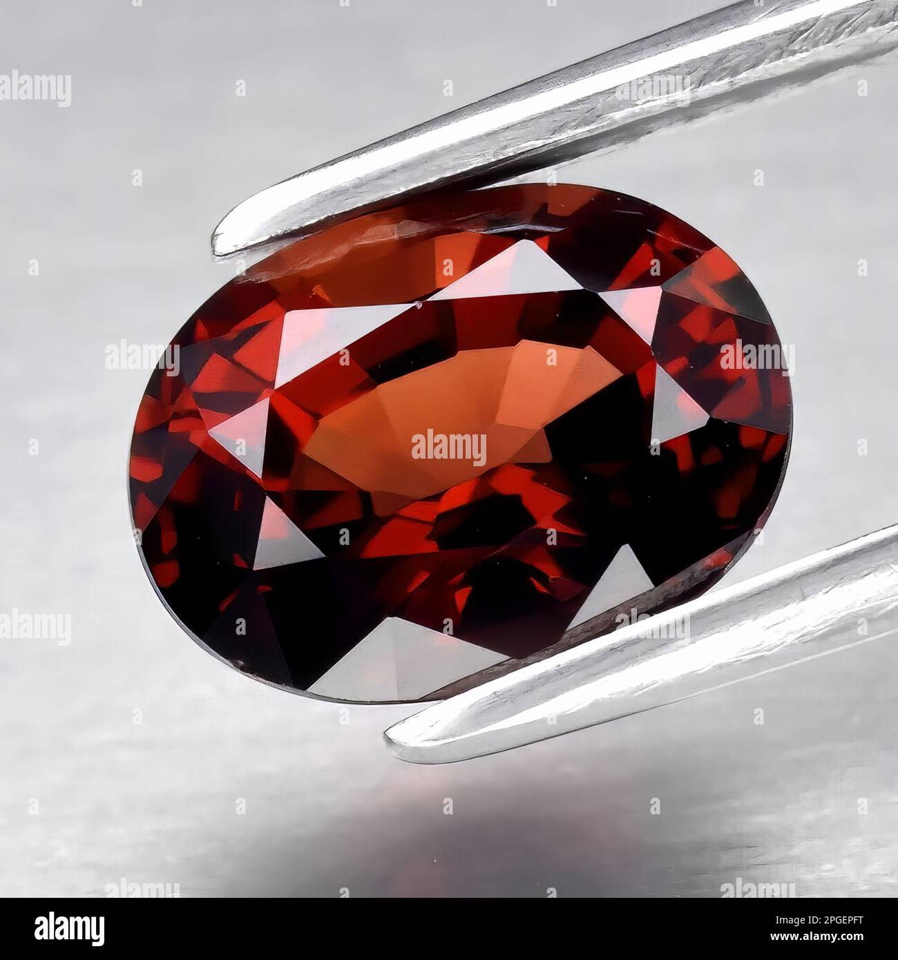 Natural gem red rhodolite garnet on gray background Stock Photo - Alamy