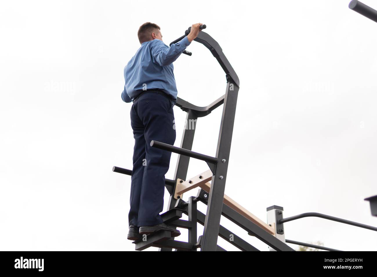 Businessman doing exercises on trainers in the gym. a man in a business ...
