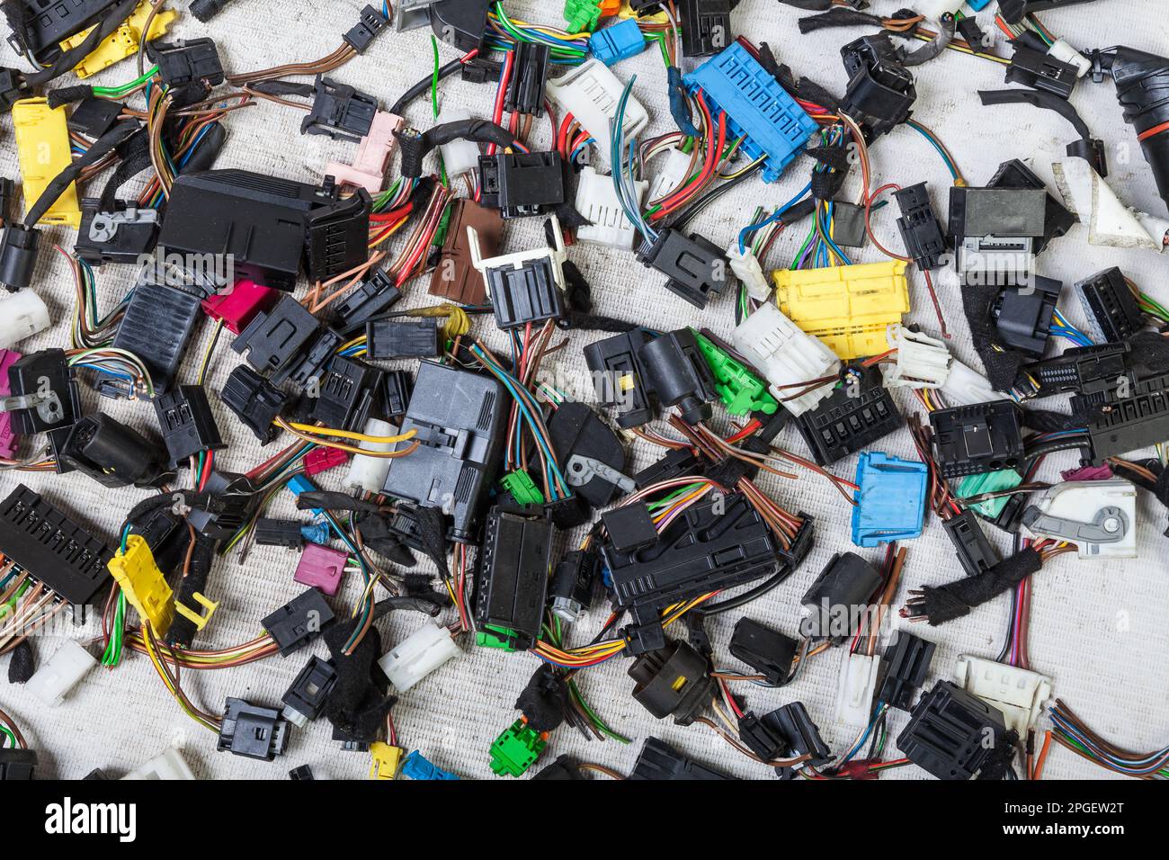 Multi-colored electrical wires with car connectors on a white isolated ...