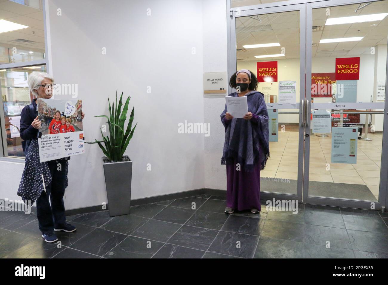 Climate activist Lydia reads a letter addressing their concerns in the ...