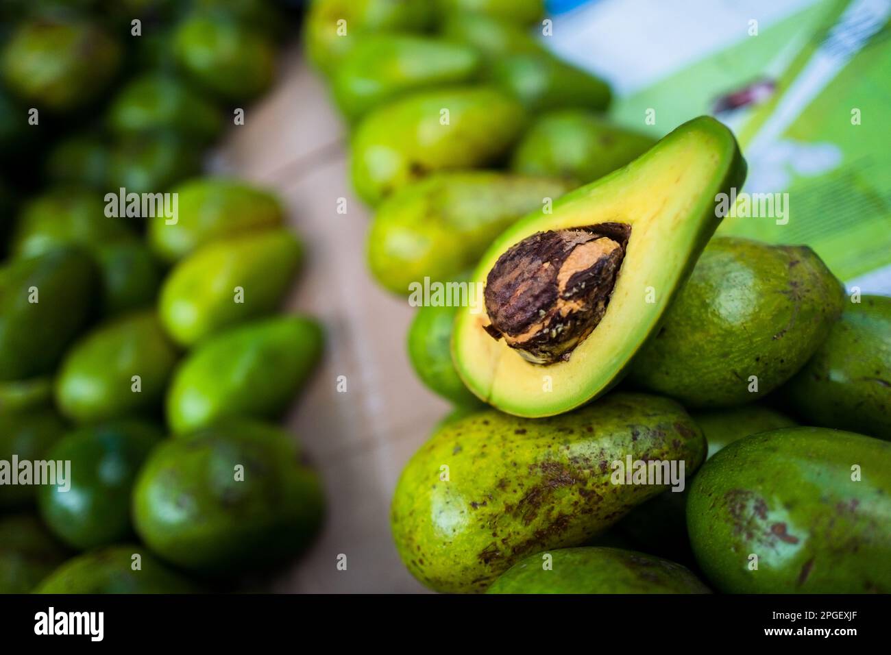 Fresh and ripe avocados are seen arranged on the market stand for sale ...