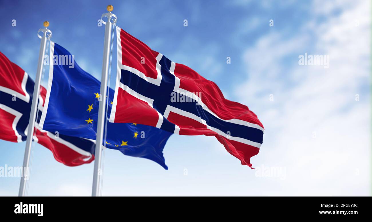 flags of Norway waving with European Union flag on a clear day ...