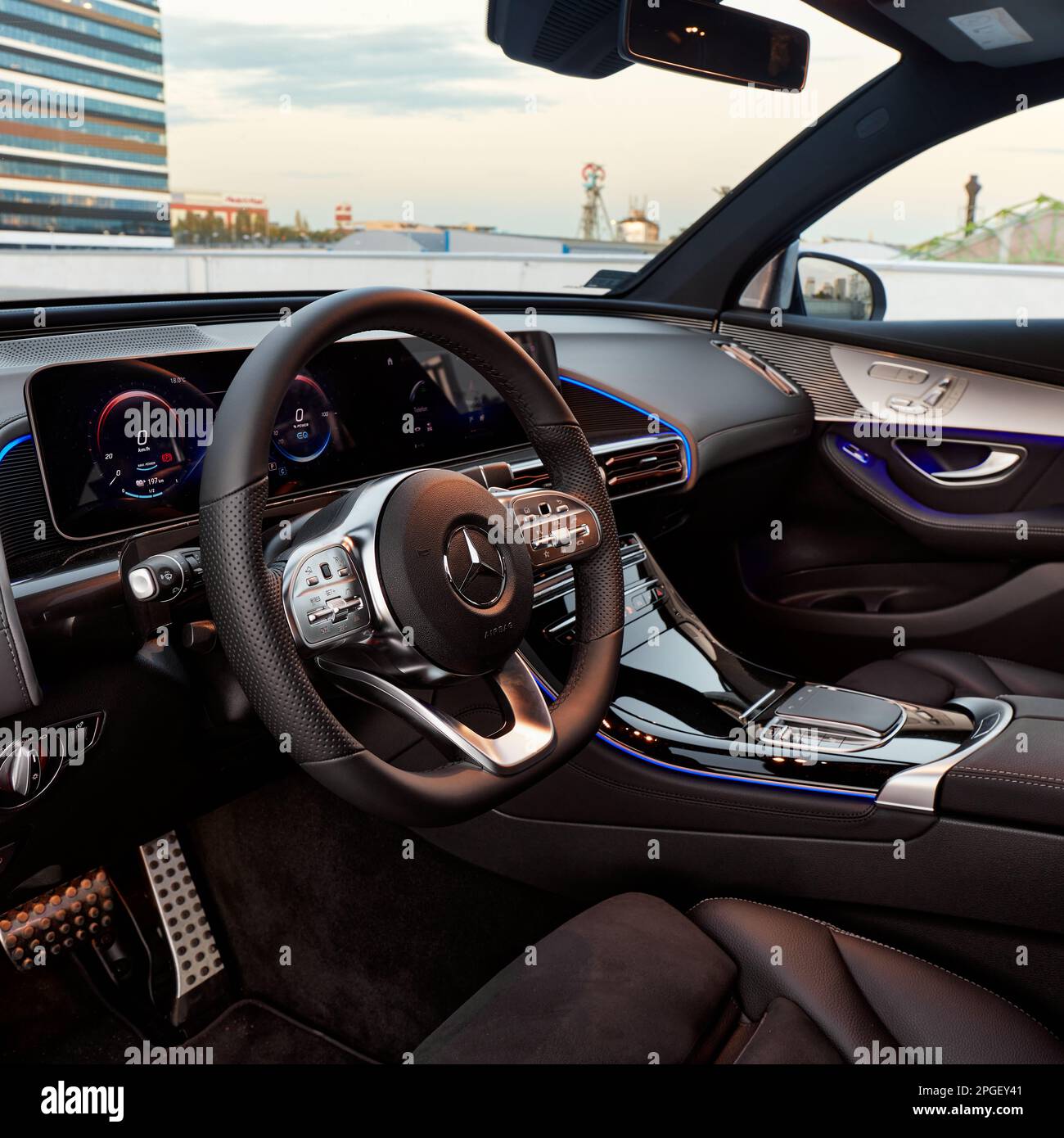 Electric Mercedes EQC cockpit with a view of the city center. The car ...