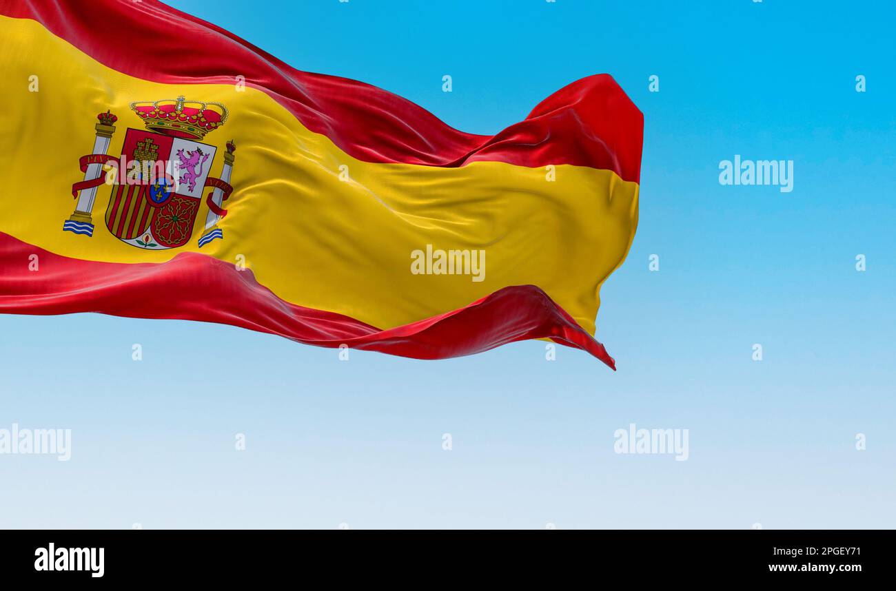 The national flag of Spain waving in the wind in a clear day. European ...