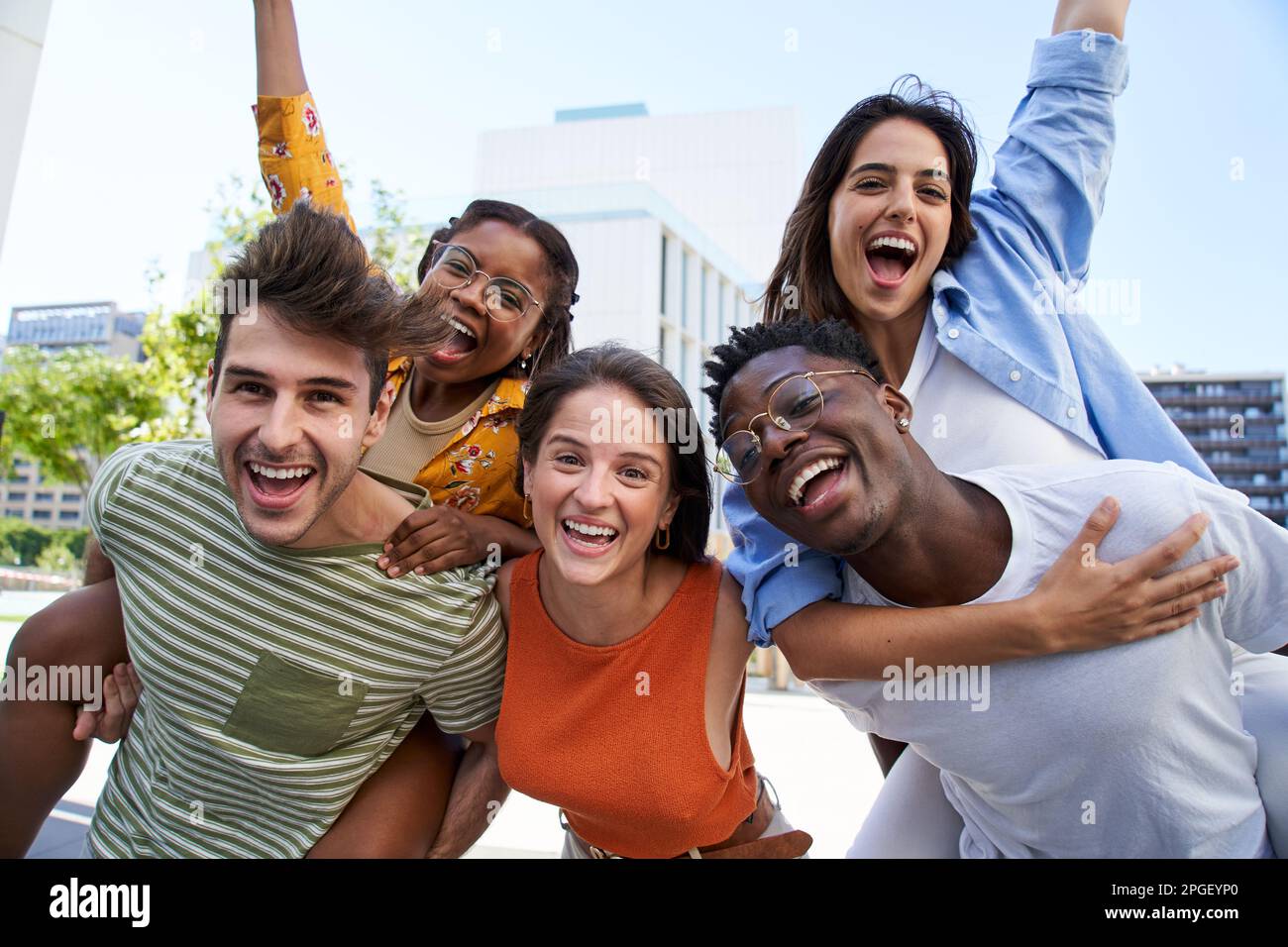 Five young happy students hugging hi-res stock photography and images ...
