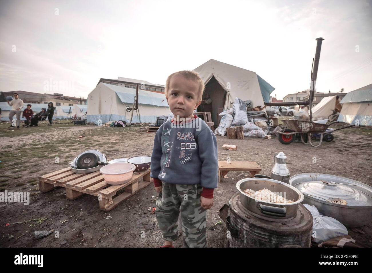 Kahramanmara, Turkey. 8th Mar, 2023. A little boy stands outside his ...