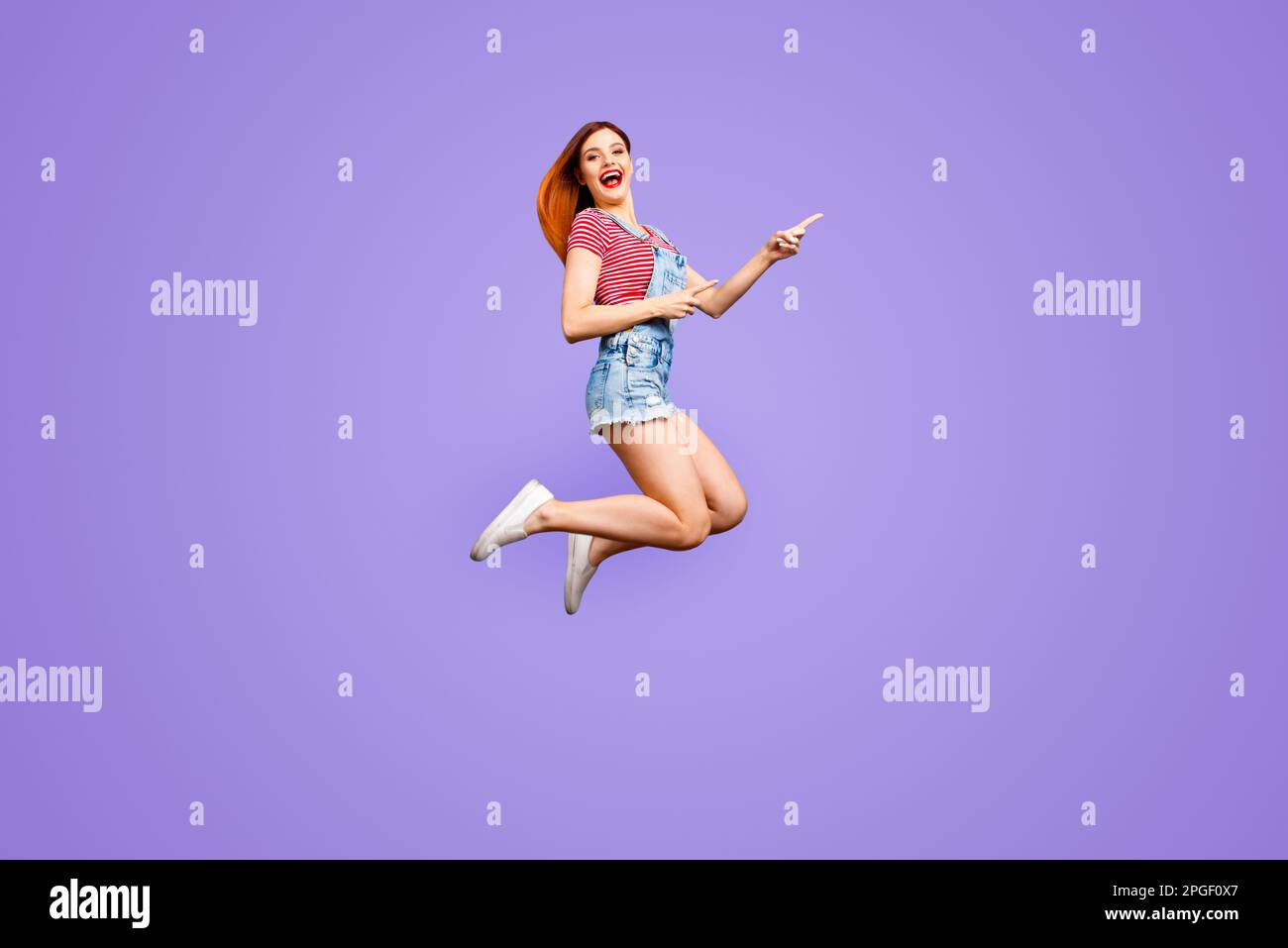 Full-size excited cheerful careless girl demonstrating empty place ...
