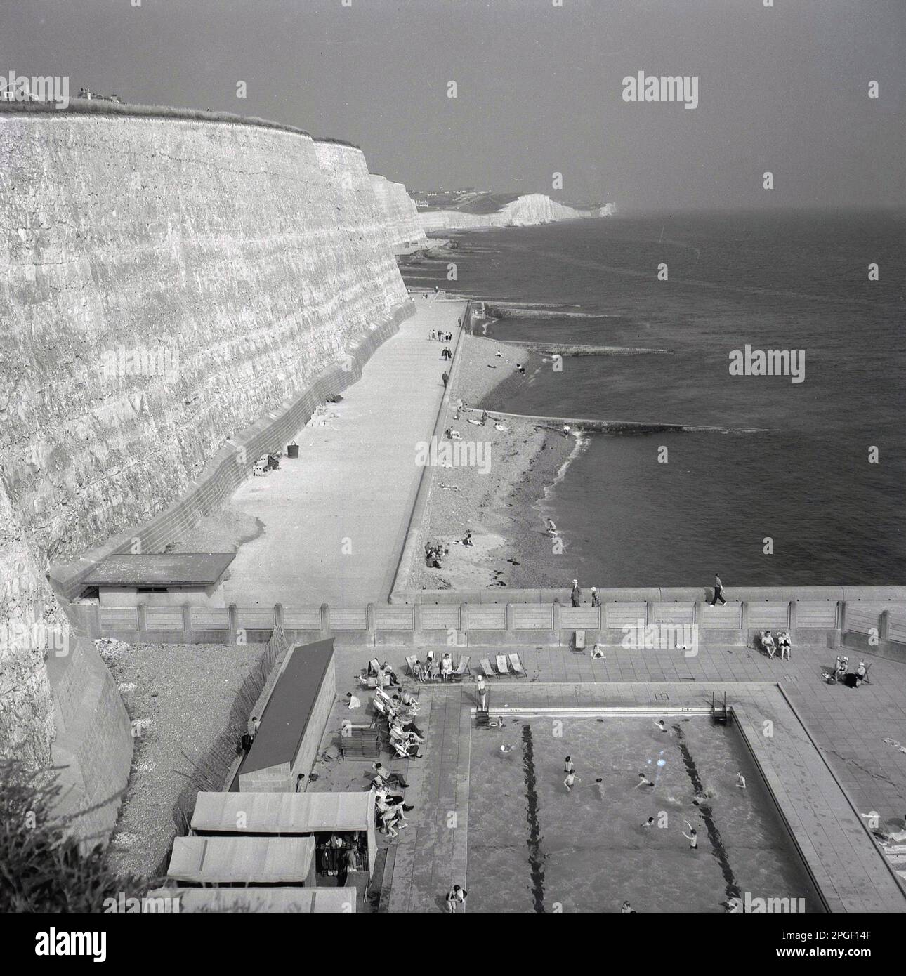 1950s, historical, an aerial view over at an open-air swimming pool ...