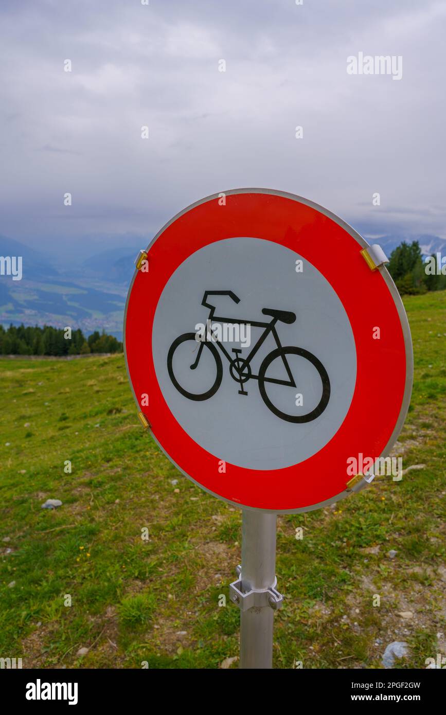 warning falling rocks sign isolated on blue Stock Photo - Alamy