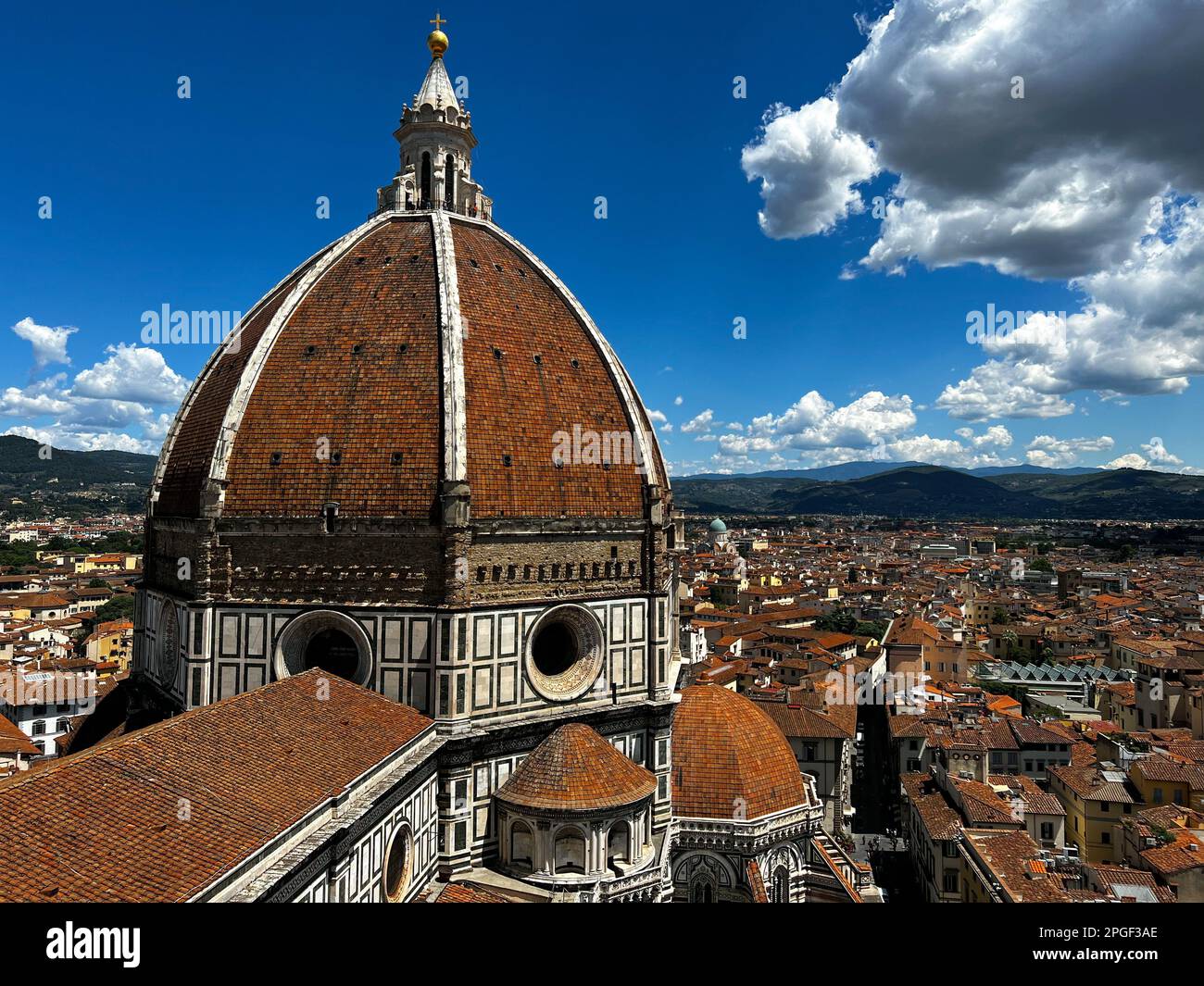 An aerial view of the historic Florence cathedral with a city view in ...