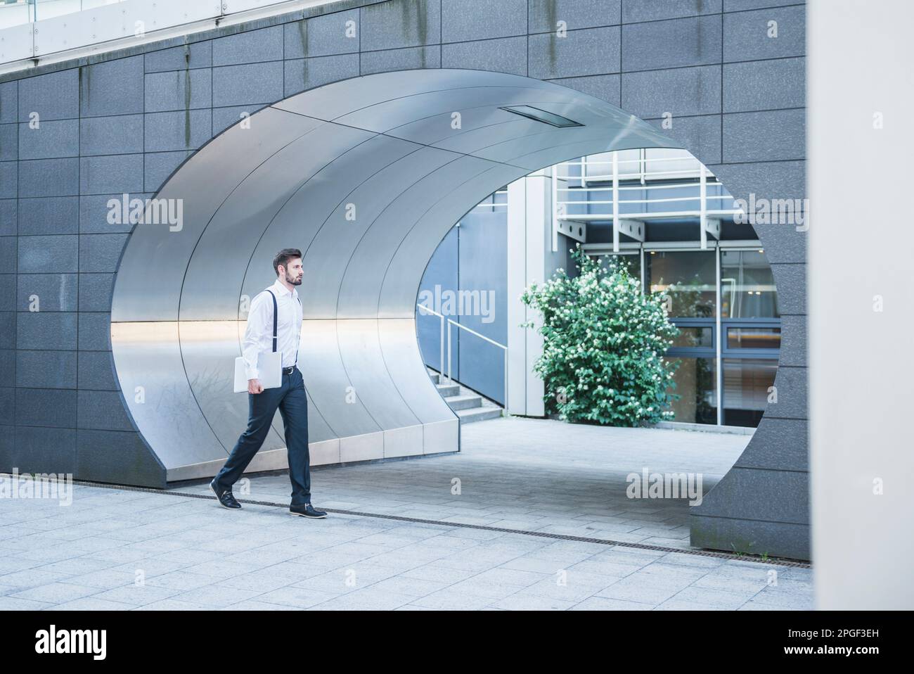 Professional man walking laptop computer hi-res stock photography and ...