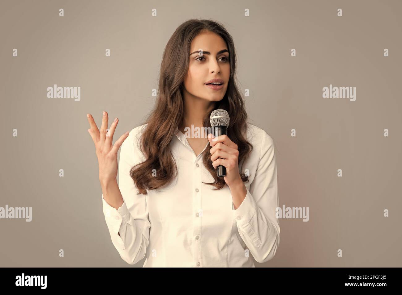 Beautiful business woman is speaking on conference. Young business ...