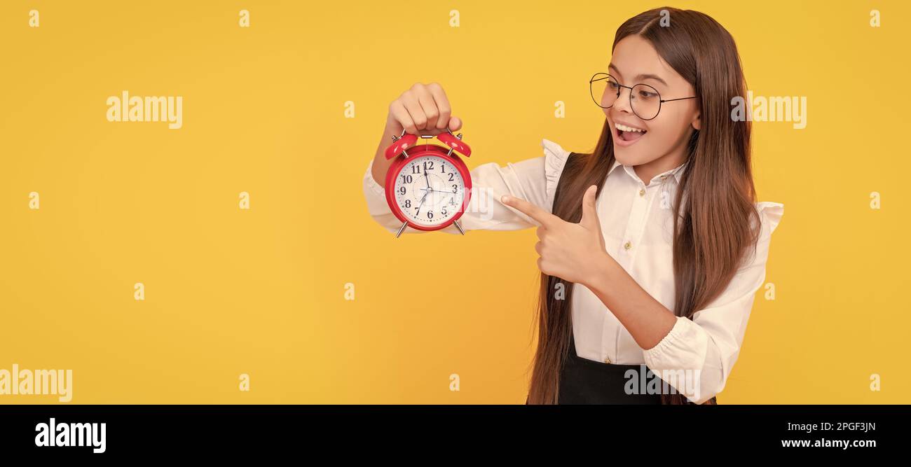 punctual teen girl checking time. happy nerd child pointing finger on ...