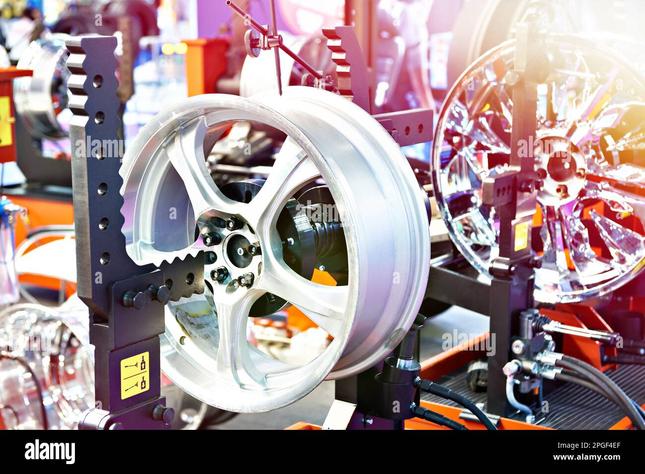 Stand for the straightening alloy wheels disk Stock Photo - Alamy