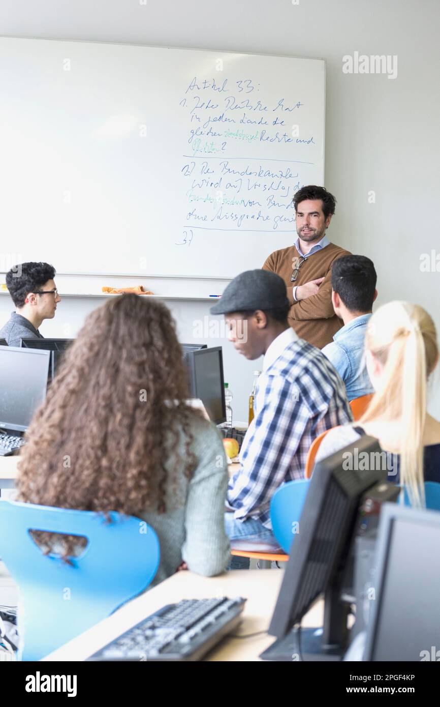 Teacher giving lecture in classroom School, Bavaria, Germany Stock ...