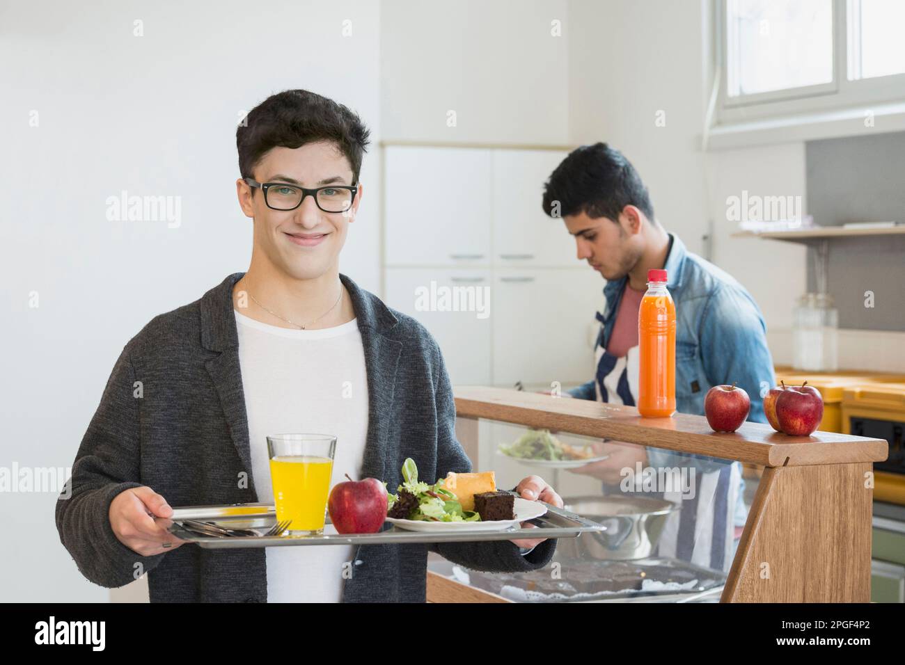 University student with his lunch in plate School, Bavaria, Germany ...