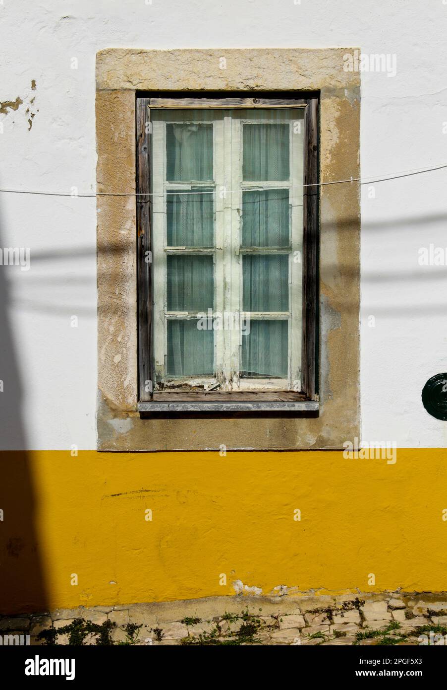 Old colorful and bright typical facade in Lisbon with beautiful white ...