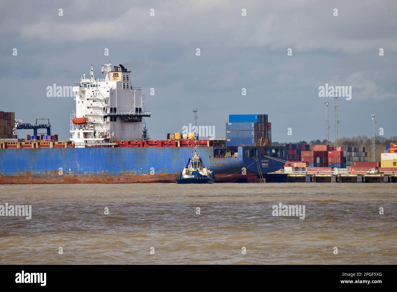 Container ship MSC Mirella leaving the Port of Felixstowe assisted by ...