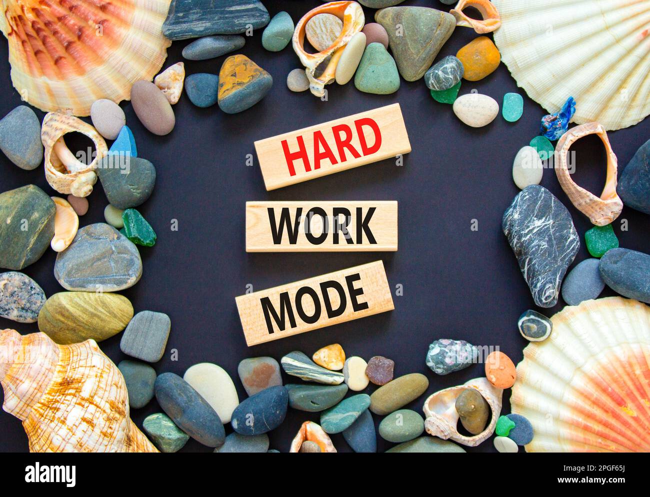 Hard work mode symbol. Concept words Hard work mode on wooden block on ...