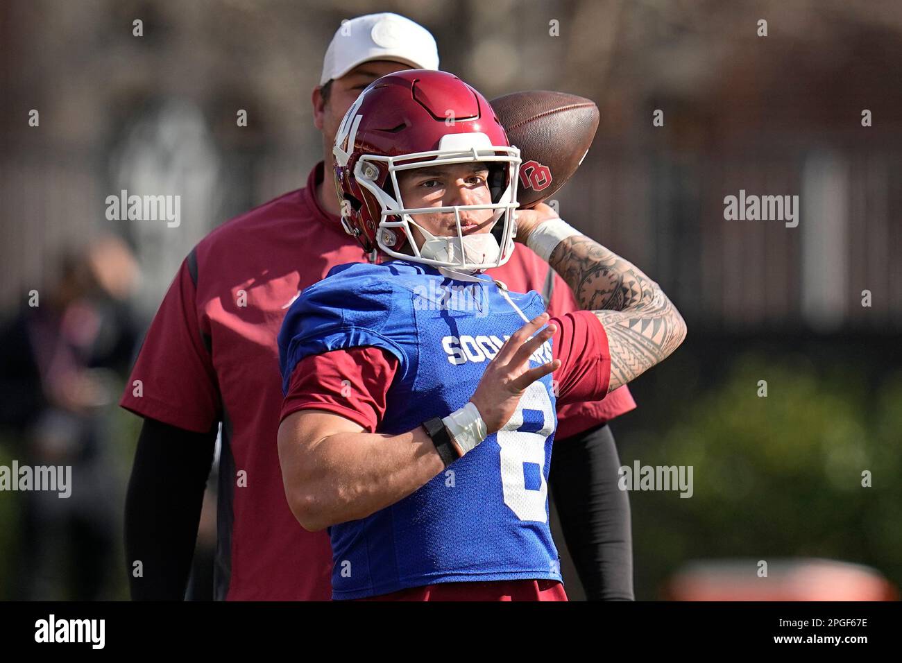 Oklahoma quarterback Dillon Gabriel throws in front of Jeff Lebby, rear ...