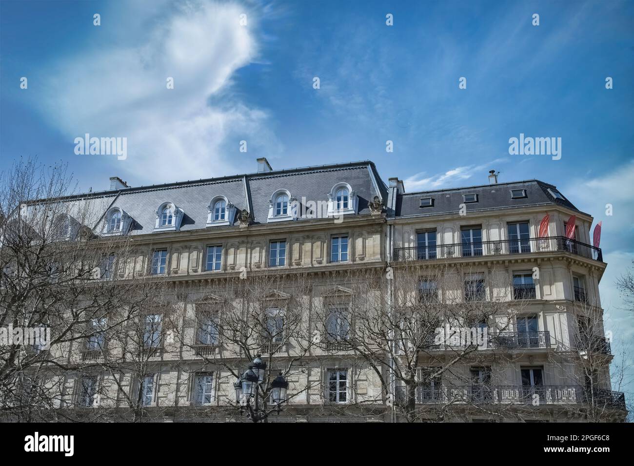 Paris, ancient buildings, typical parisian facades with a lamppost ...