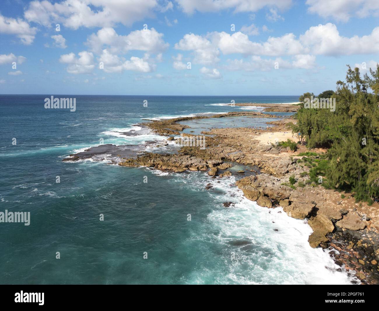 An aerial view of the sunny Shark's Cove, North Shore, Oahu, Hawaii ...