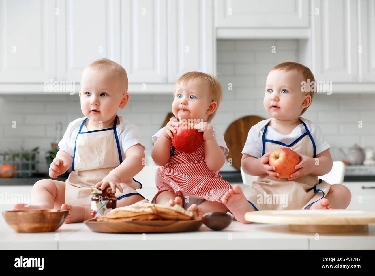 mockup of triplets in the kitchen with fruits and other products Stock ...