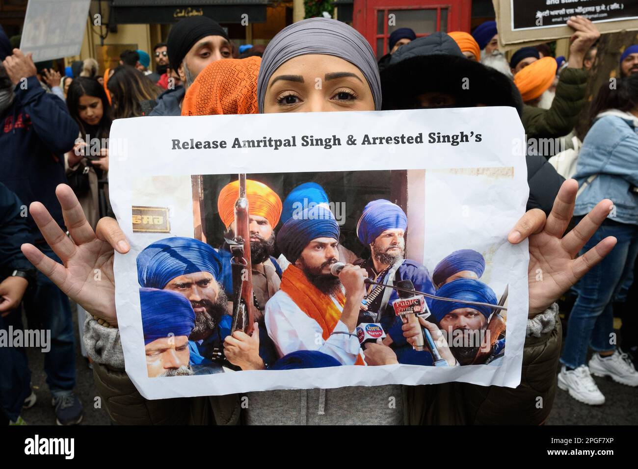 London, UK. 22 March, 2023. A woman holds a poster calling for the ...
