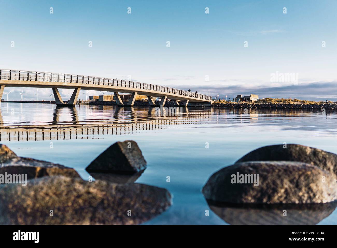 river landscape and people passing through the bridge Stock Photo - Alamy