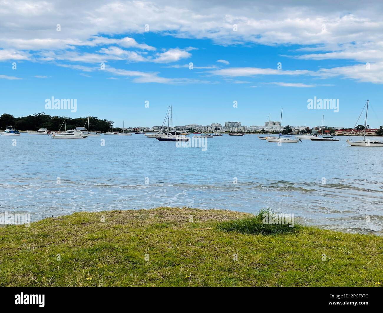 Boats floating in blue river water on clear summer day Stock Photo - Alamy