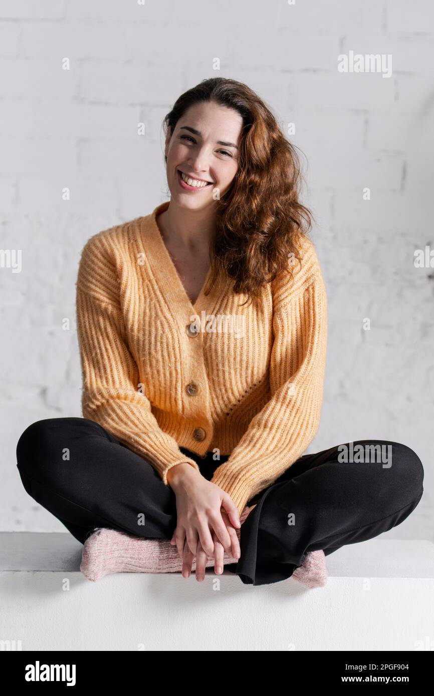 Beautiful woman sitting crossed legs hi-res stock photography and ...