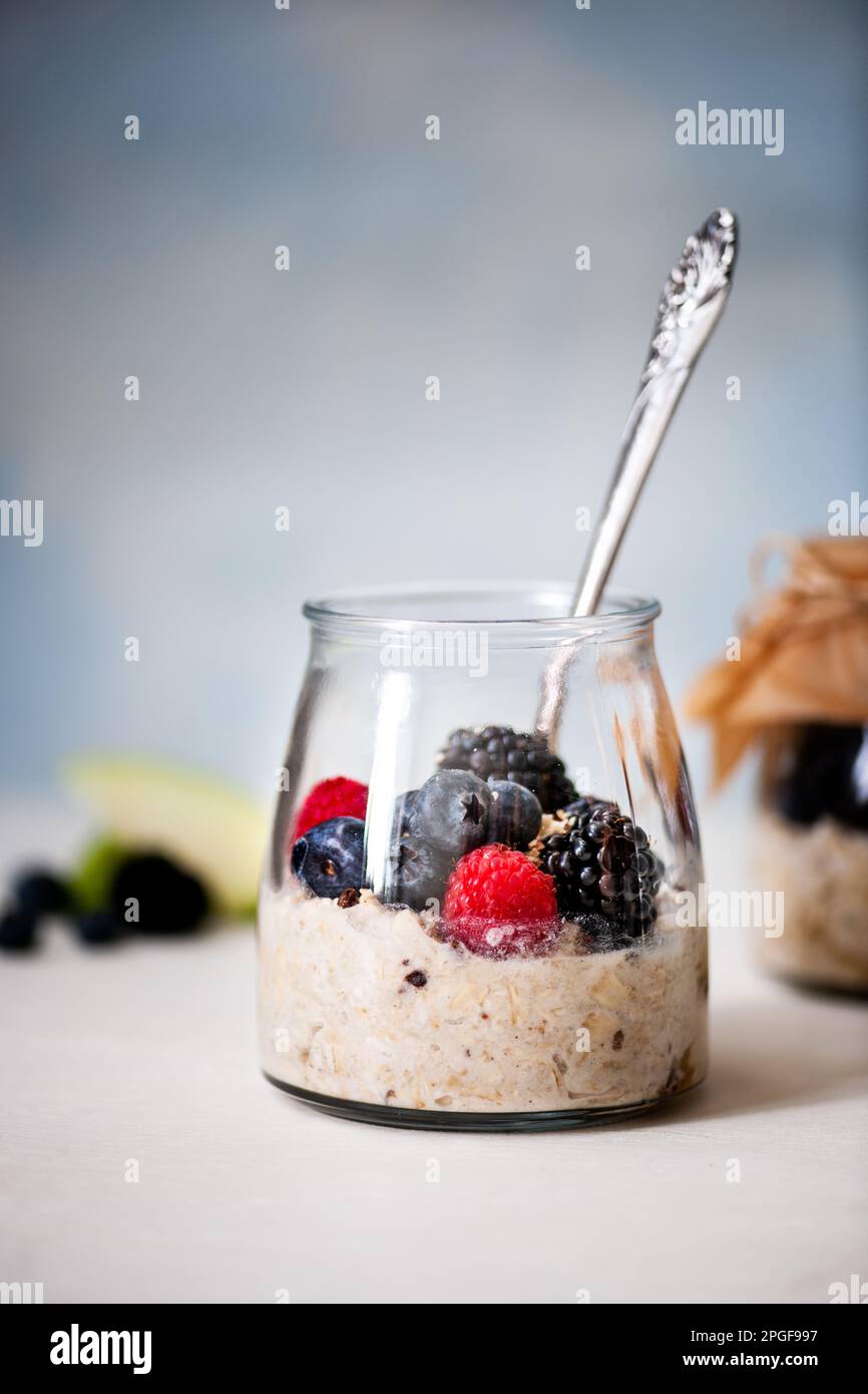 Healthy morning oatmeal and berries in glass bowl Stock Photo - Alamy
