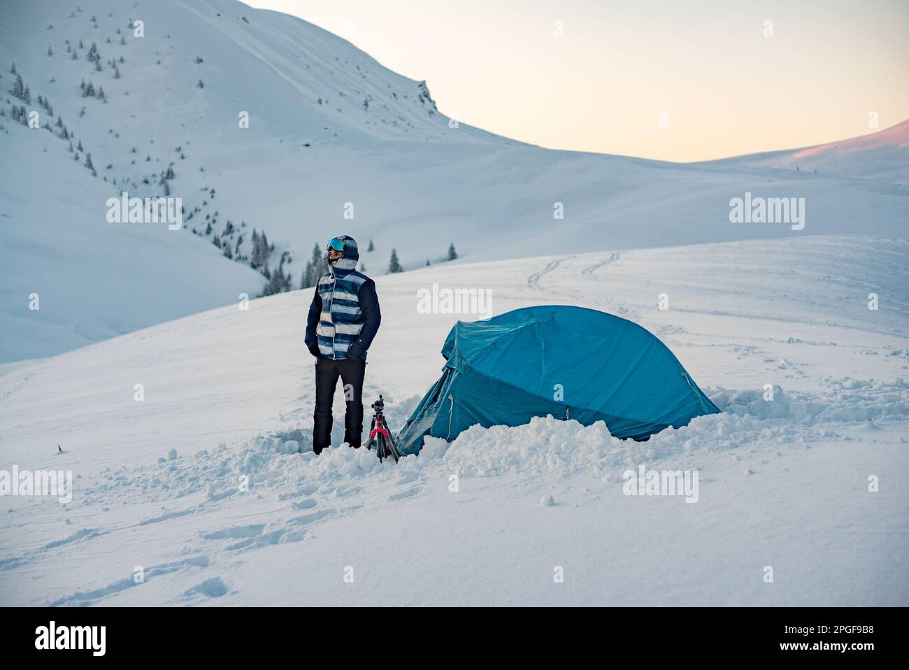 Hiker Camping in Freezing Temperature in the Winter Stock Photo - Alamy