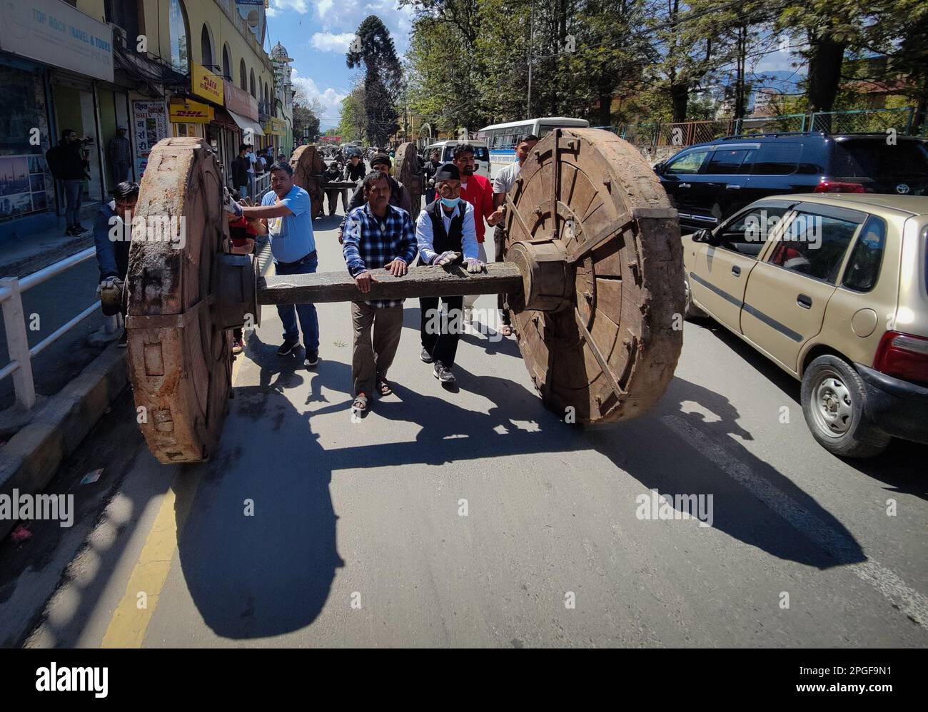 Kathmandu, Bagmati, Nepal. 22nd Mar, 2023. People roll the wheels in preparation of chariot for ...