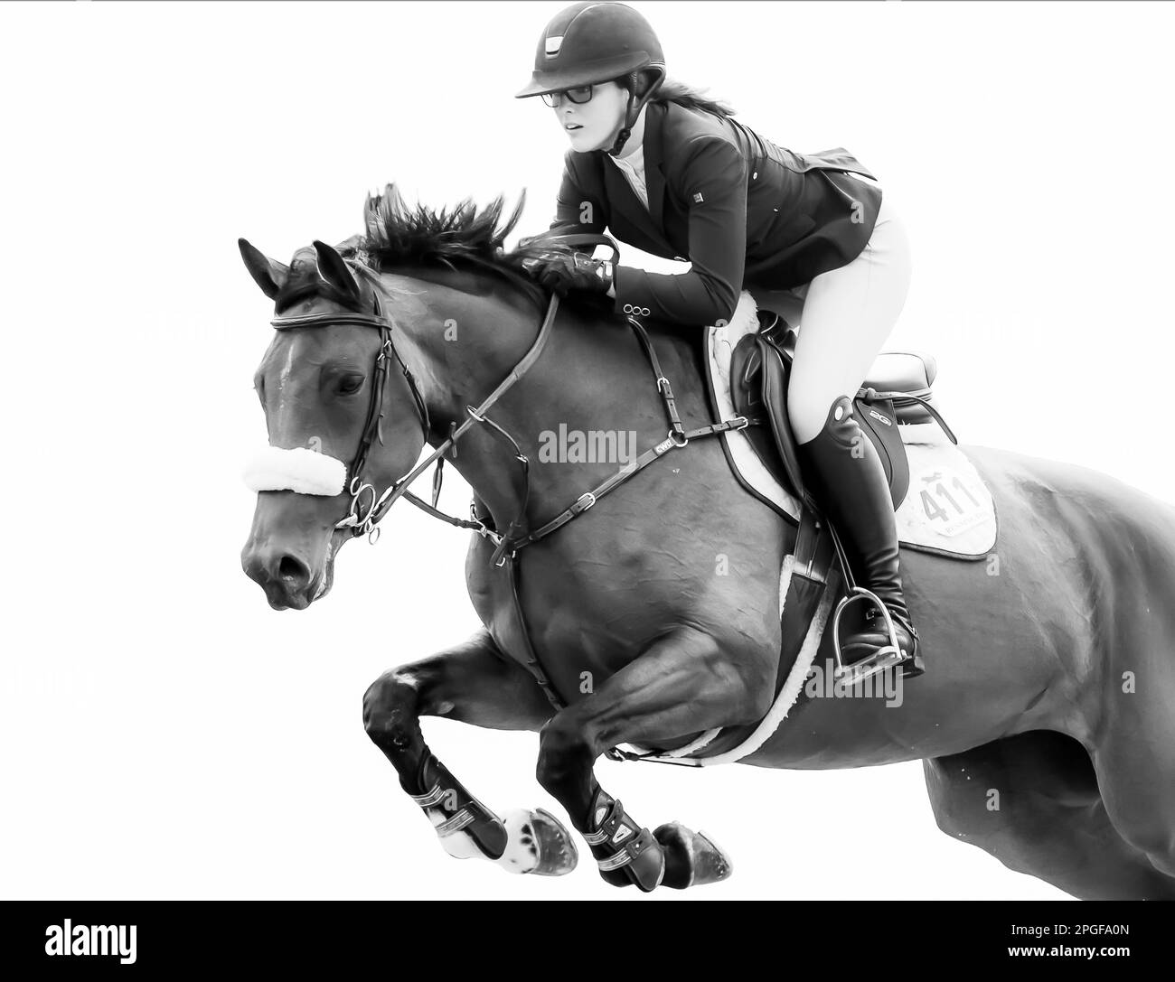 Riders compete with their mounts. Image has been edited to remove ...