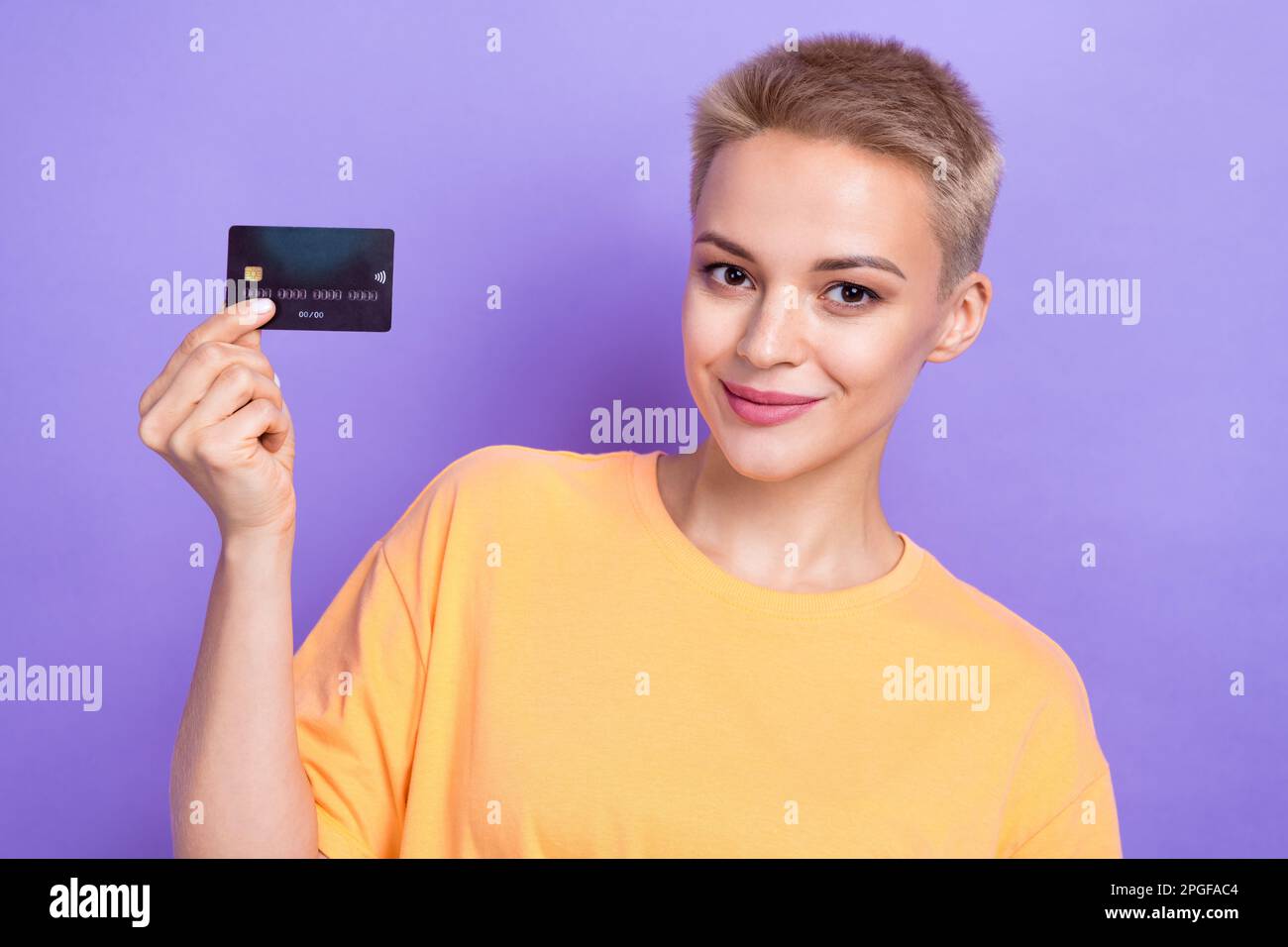Portrait of positive friendly lady hand hold showing plastic debit card ...