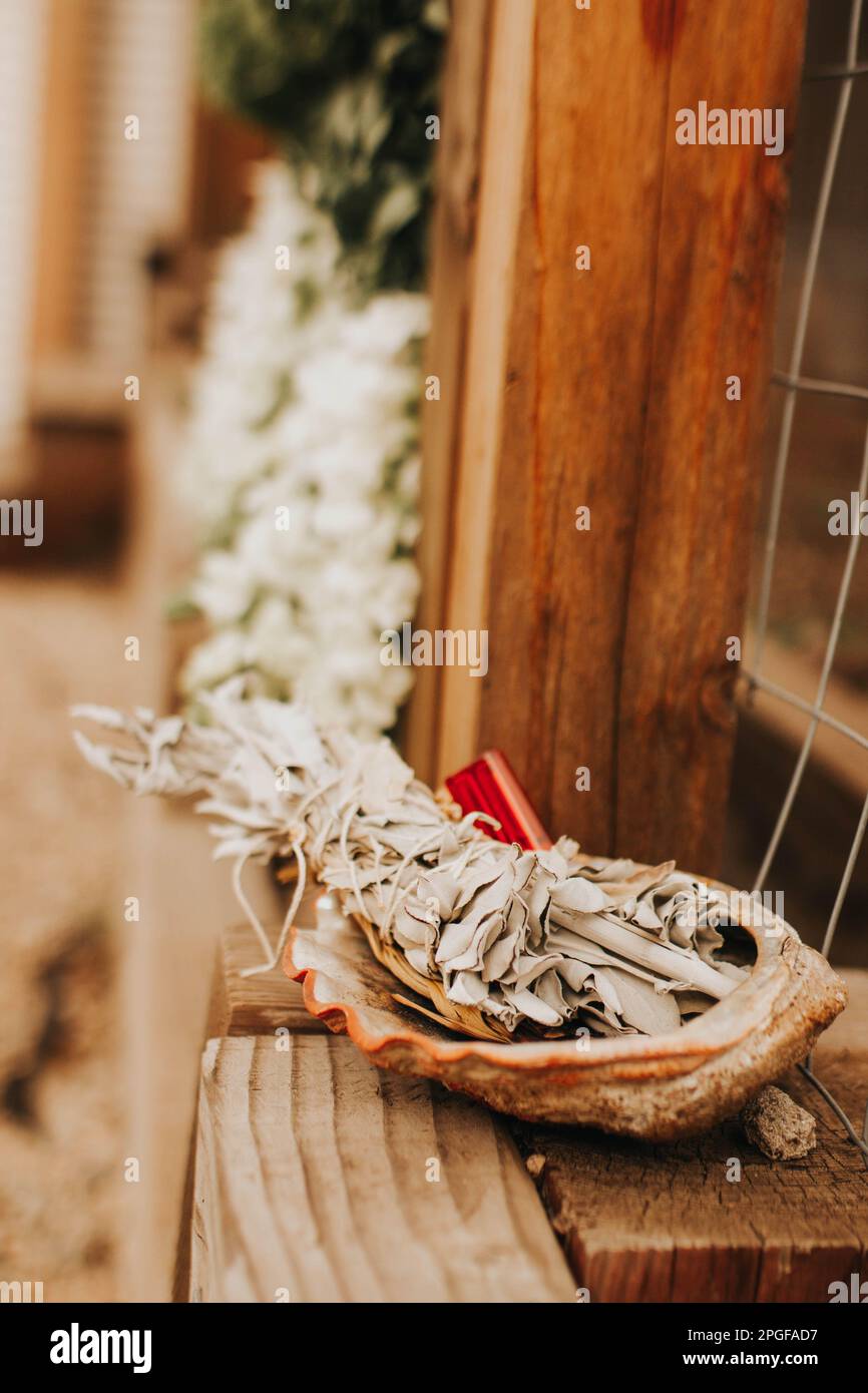 sage smudge stick inside seashell Stock Photo - Alamy